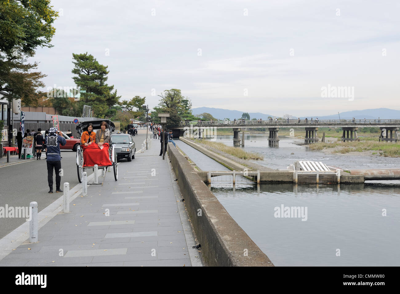 rickshaw driver taking picture of two Japanese women in rickshaw in ...