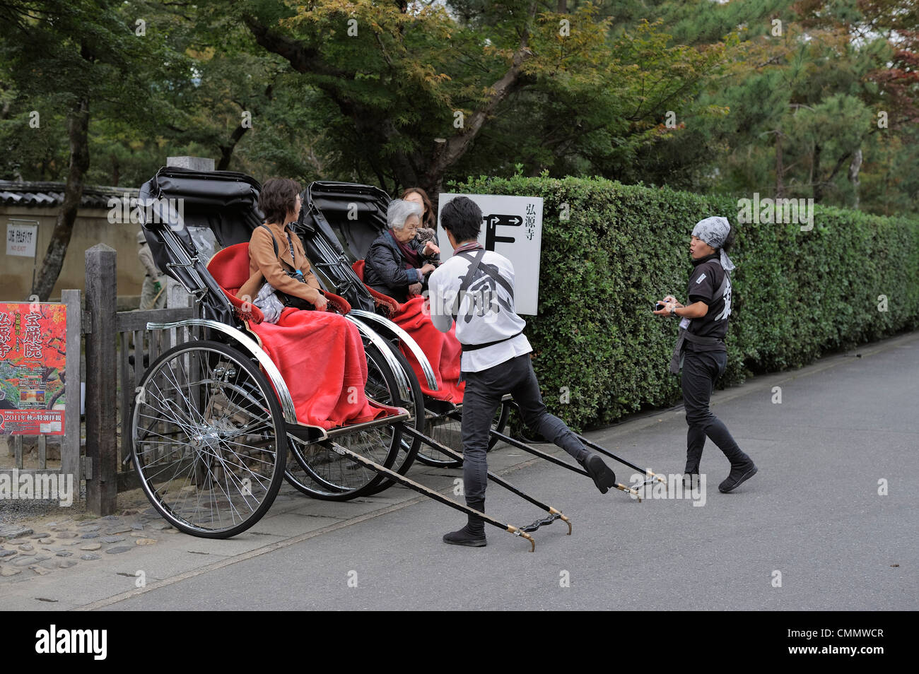 Japanese women sitting in rickshaws and their drivers, Kyoto, Japan ...