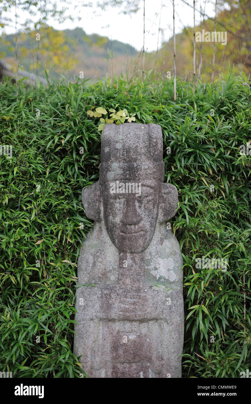 stone statue at green hedge in Arashiyama, Kyoto, Japan Stock Photo - Alamy