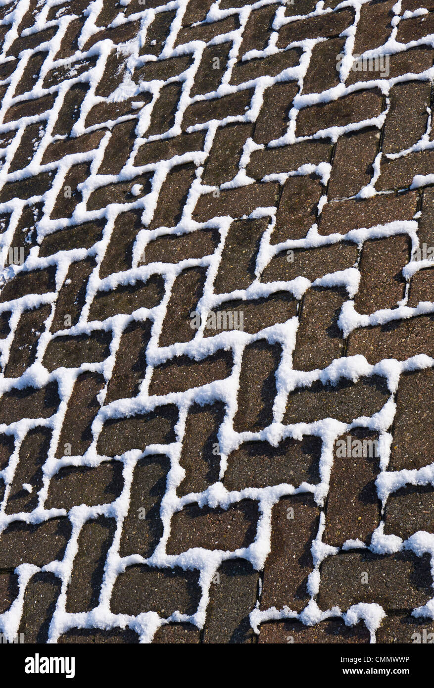 Snow on a brick weave drive Stock Photo - Alamy