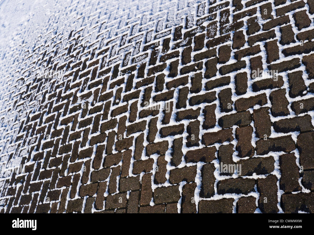 Snow on a brick weave drive Stock Photo - Alamy