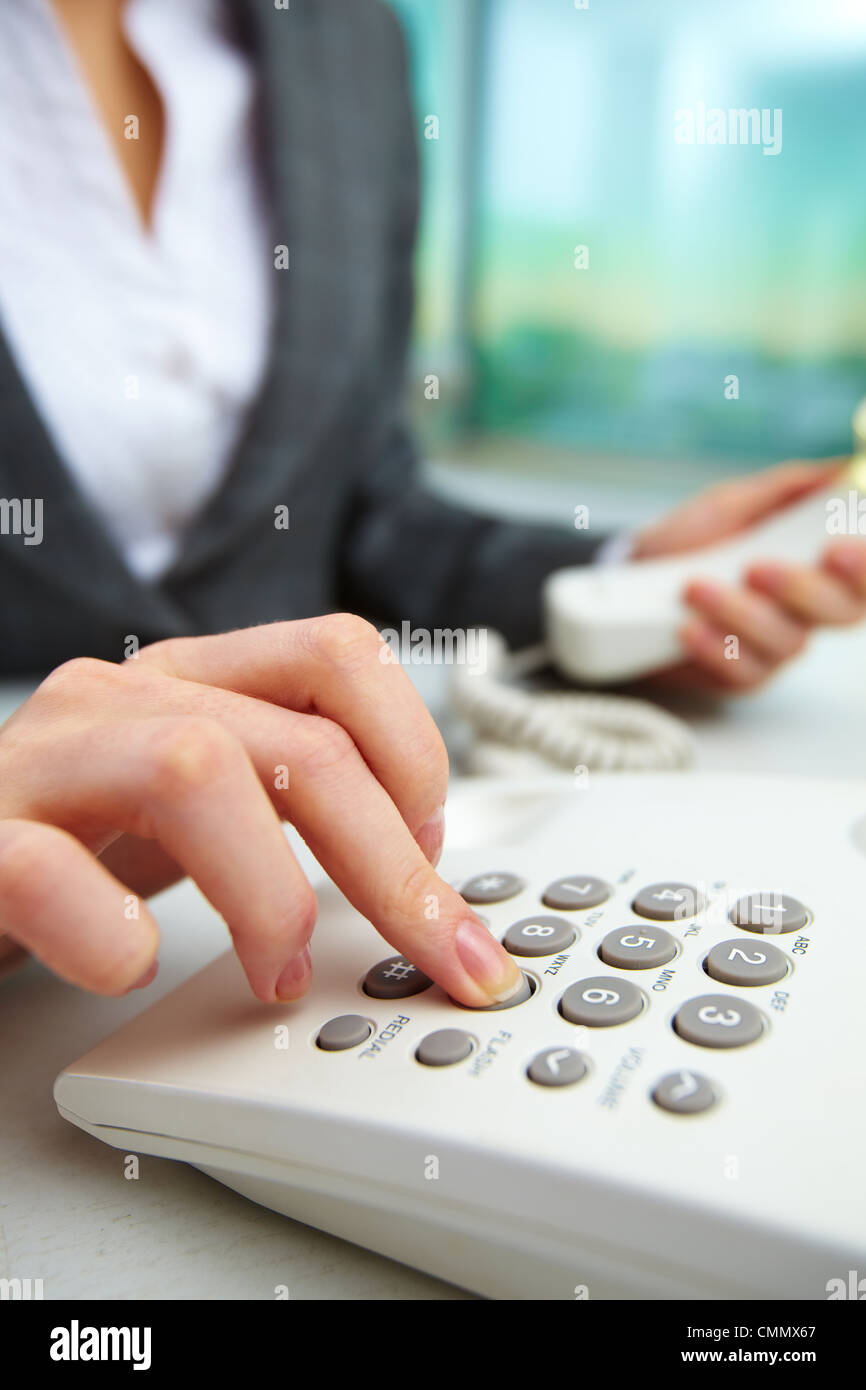 Female hand dialing telephone number Stock Photo - Alamy