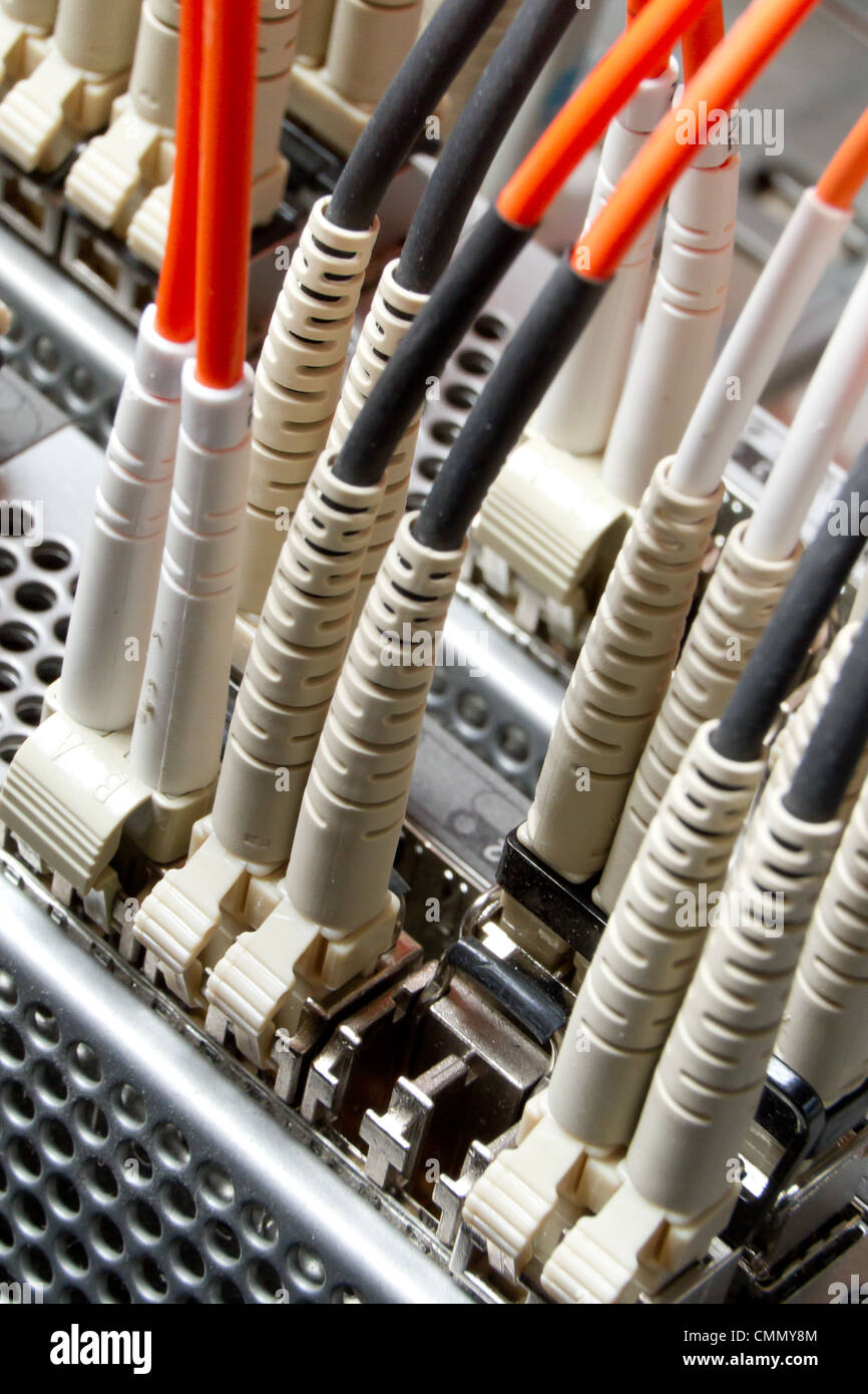 optic fiber cables connected to hub Stock Photo - Alamy