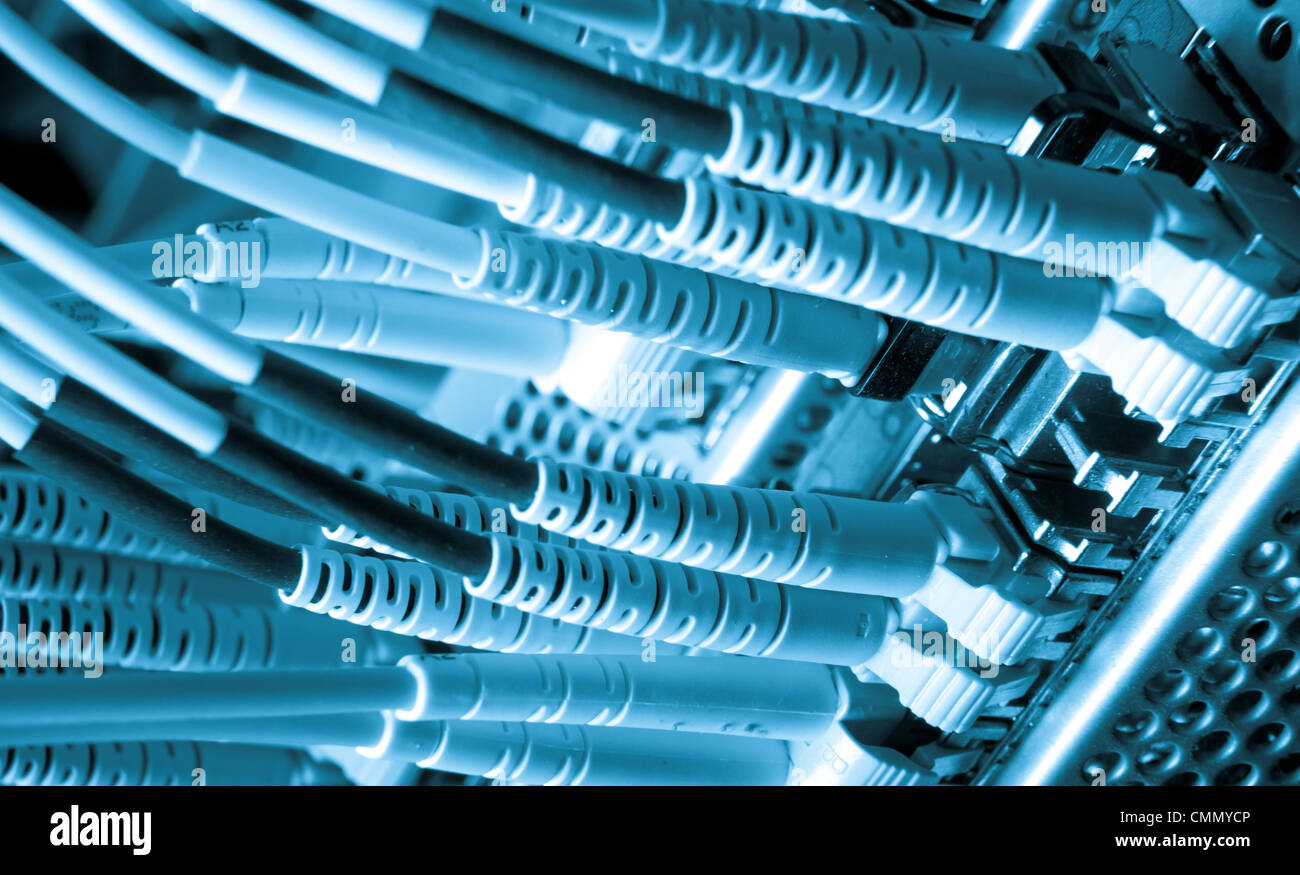 optic fiber cables connected to hub Stock Photo - Alamy
