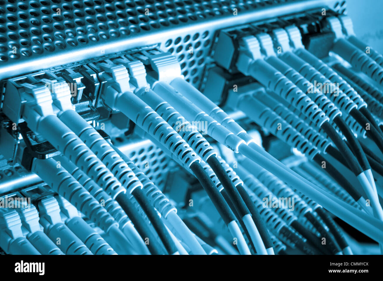 optic fiber cables connected to hub Stock Photo - Alamy