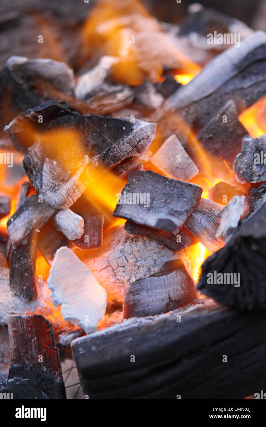 Decaying red coals of a tree in a fire Stock Photo - Alamy