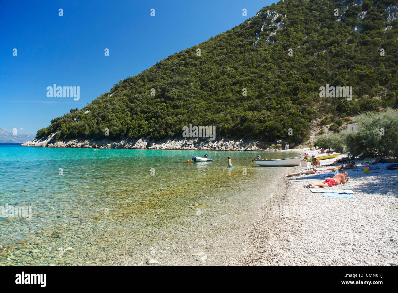 People resting on Divna beach, Peljesac peninsula, Croatia Stock Photo ...