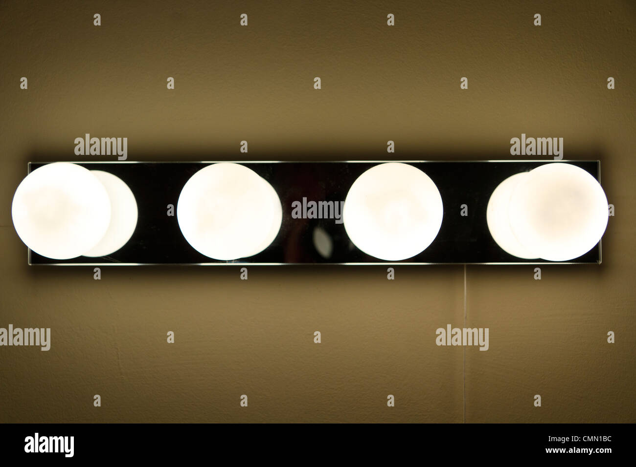 Wall light with four bulbs Stock Photo - Alamy