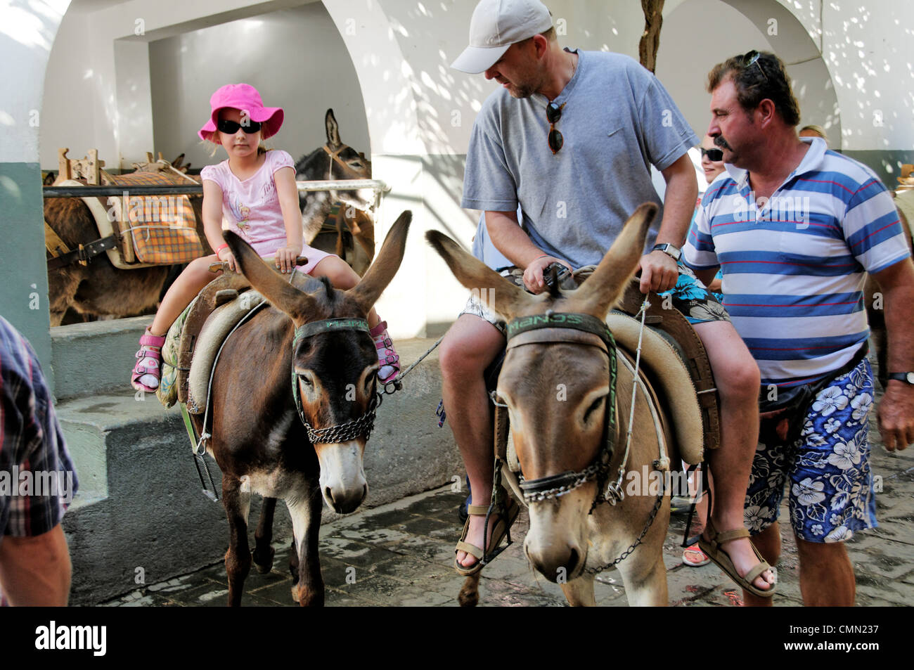 Rhodes. Greece. View of tourists on donkeys at the Donkey station ...