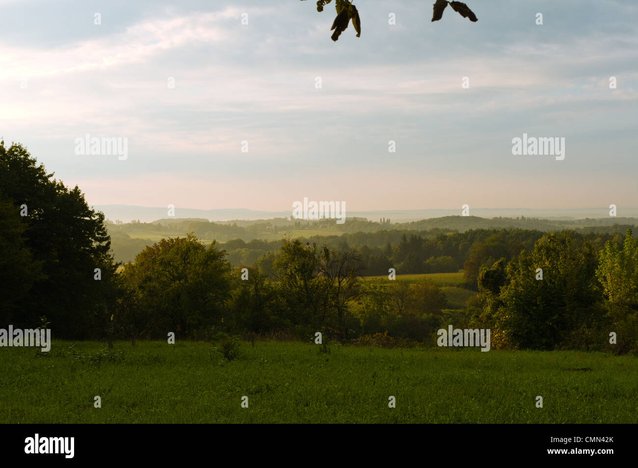 Landscape view on morning sunrise in the early spring with sun rays ...