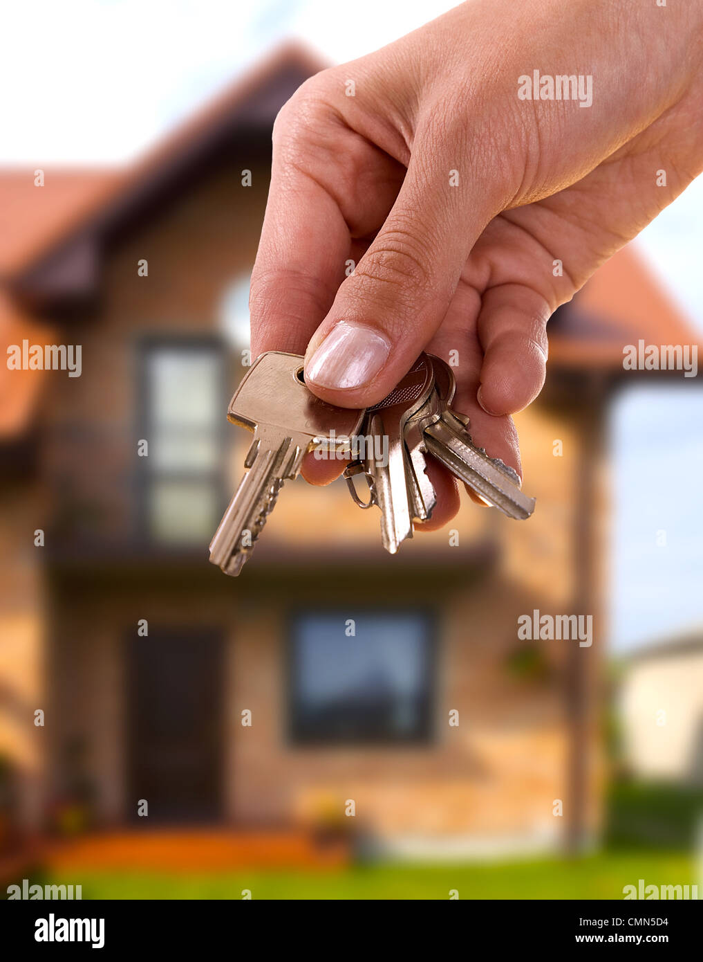handing keys in the house background Stock Photo - Alamy