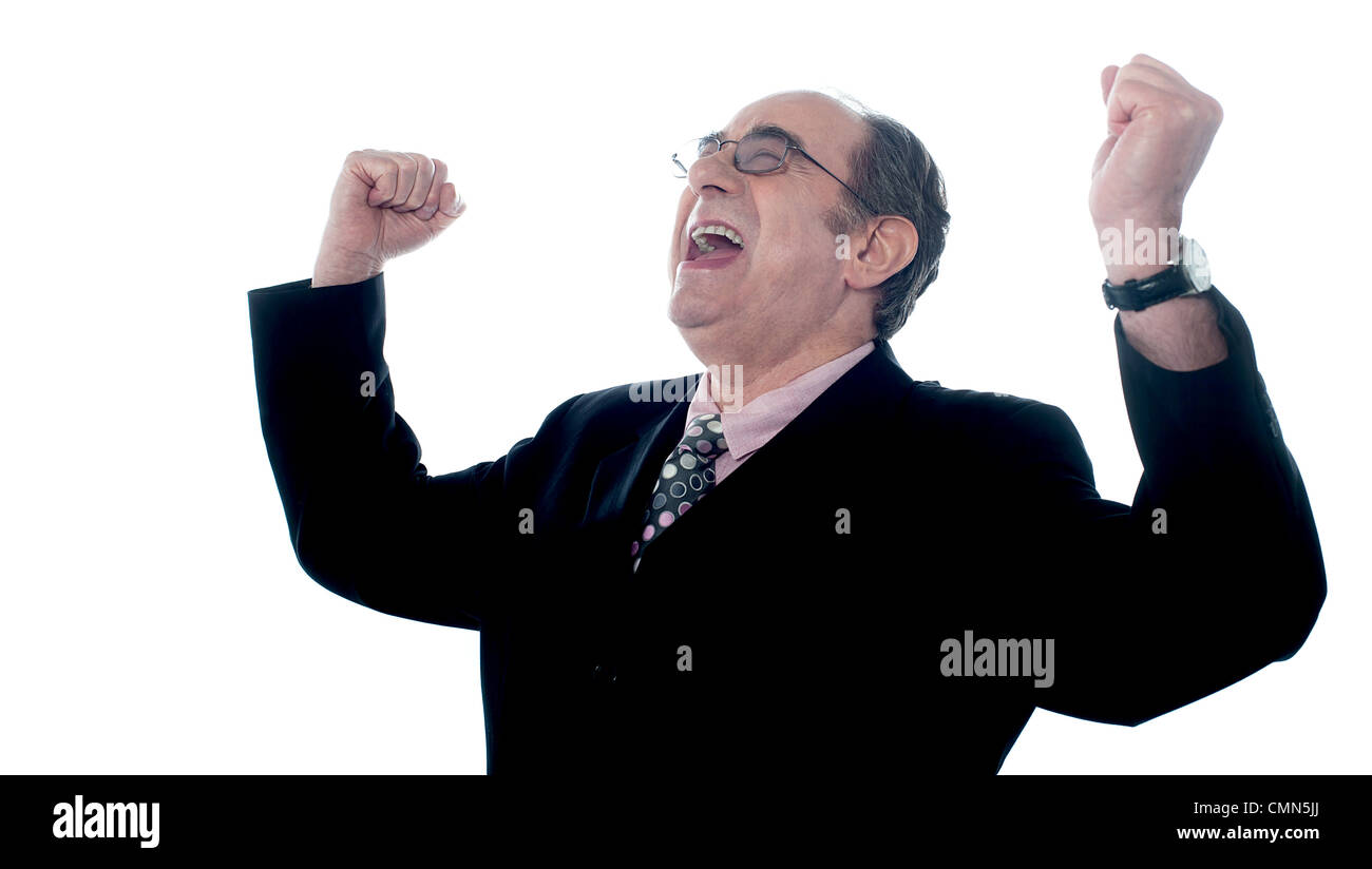 Successful old businessman shouting in excitement with arms up Stock ...
