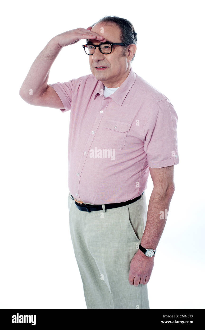 Old man looking far away by, studio shot Stock Photo - Alamy