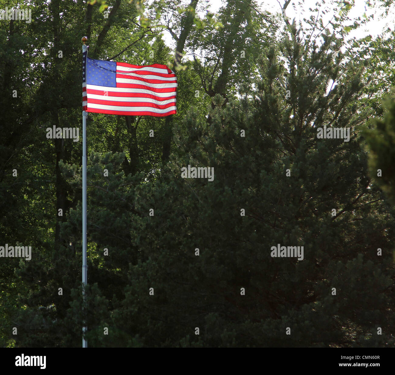 The symbol of freedom is illuminated by the setting sun Stock Photo - Alamy