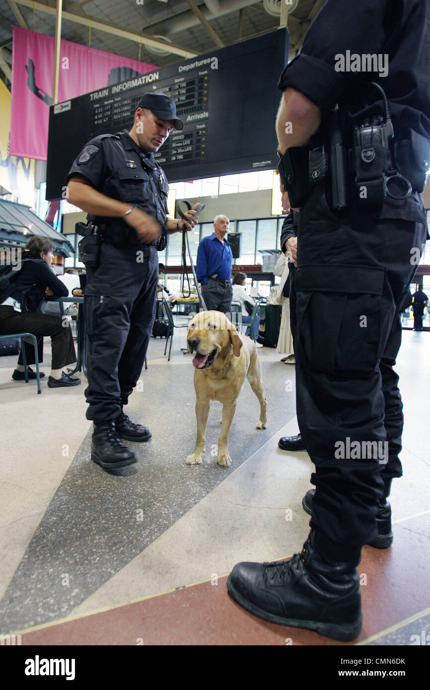Police canine patrol with a bomb sniffing dog in South Station, Boston ...