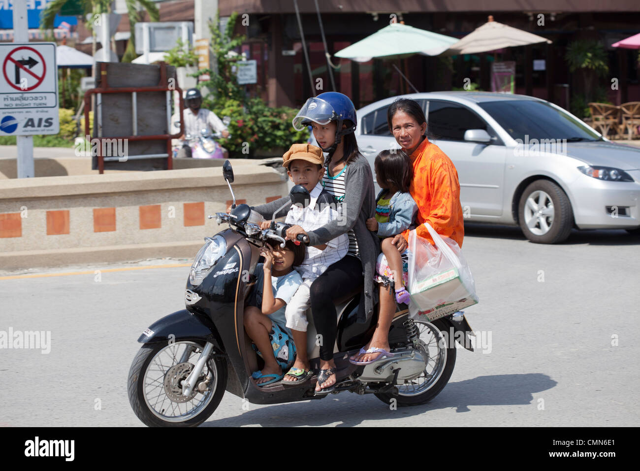 Thai family on motorcycle hi-res stock photography and images - Alamy