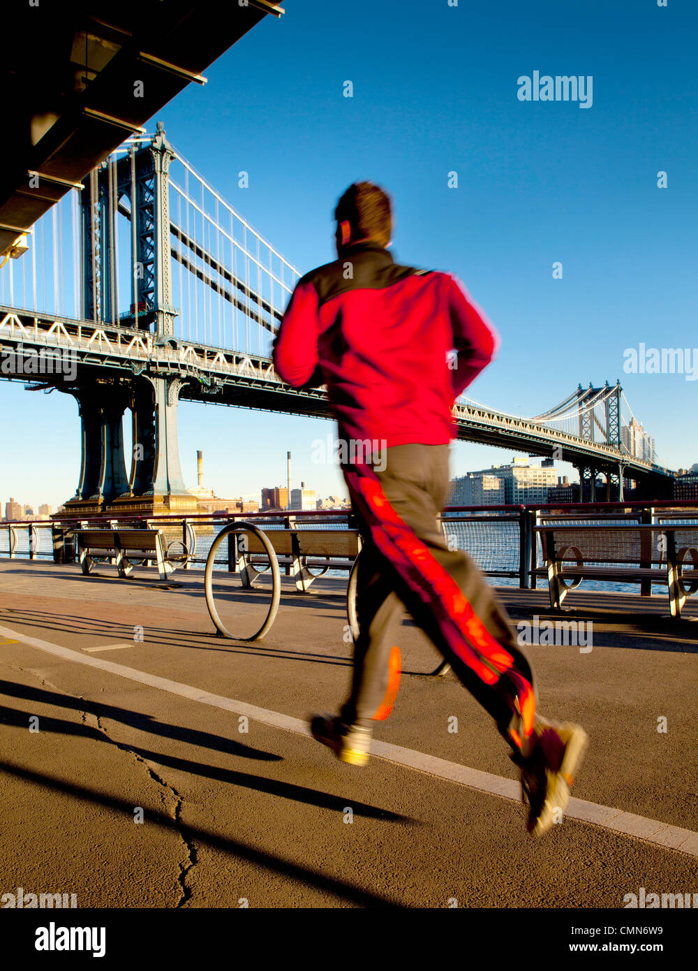 man running by Manhattan bridge, New York Stock Photo - Alamy