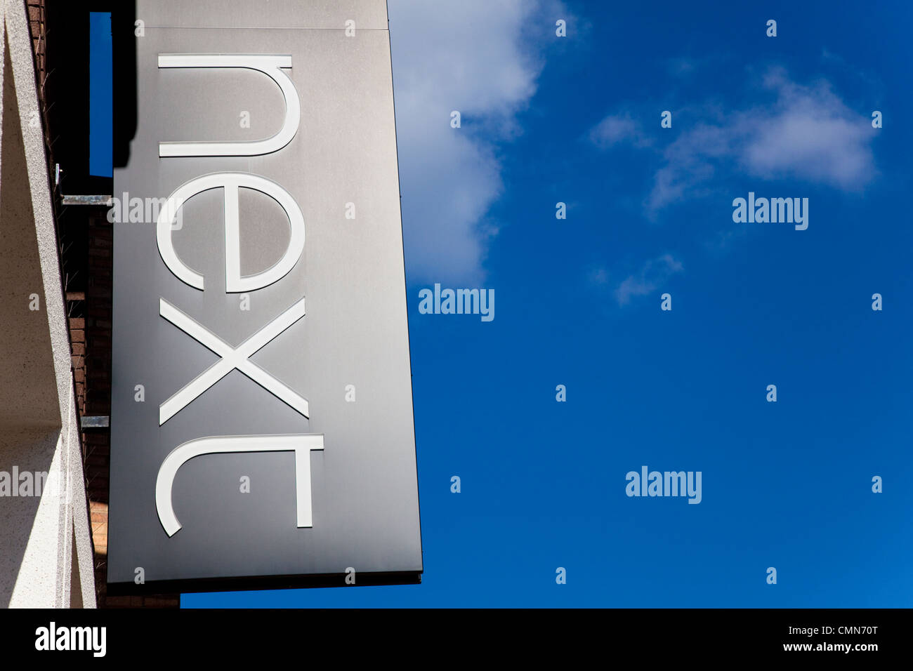 Sign above high street shop, Next, UK Stock Photo - Alamy