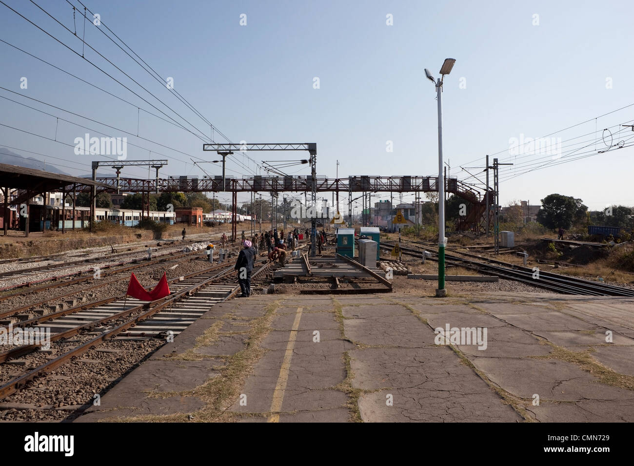 workmen repairing the railway tracks at Kalka station in the Indian ...