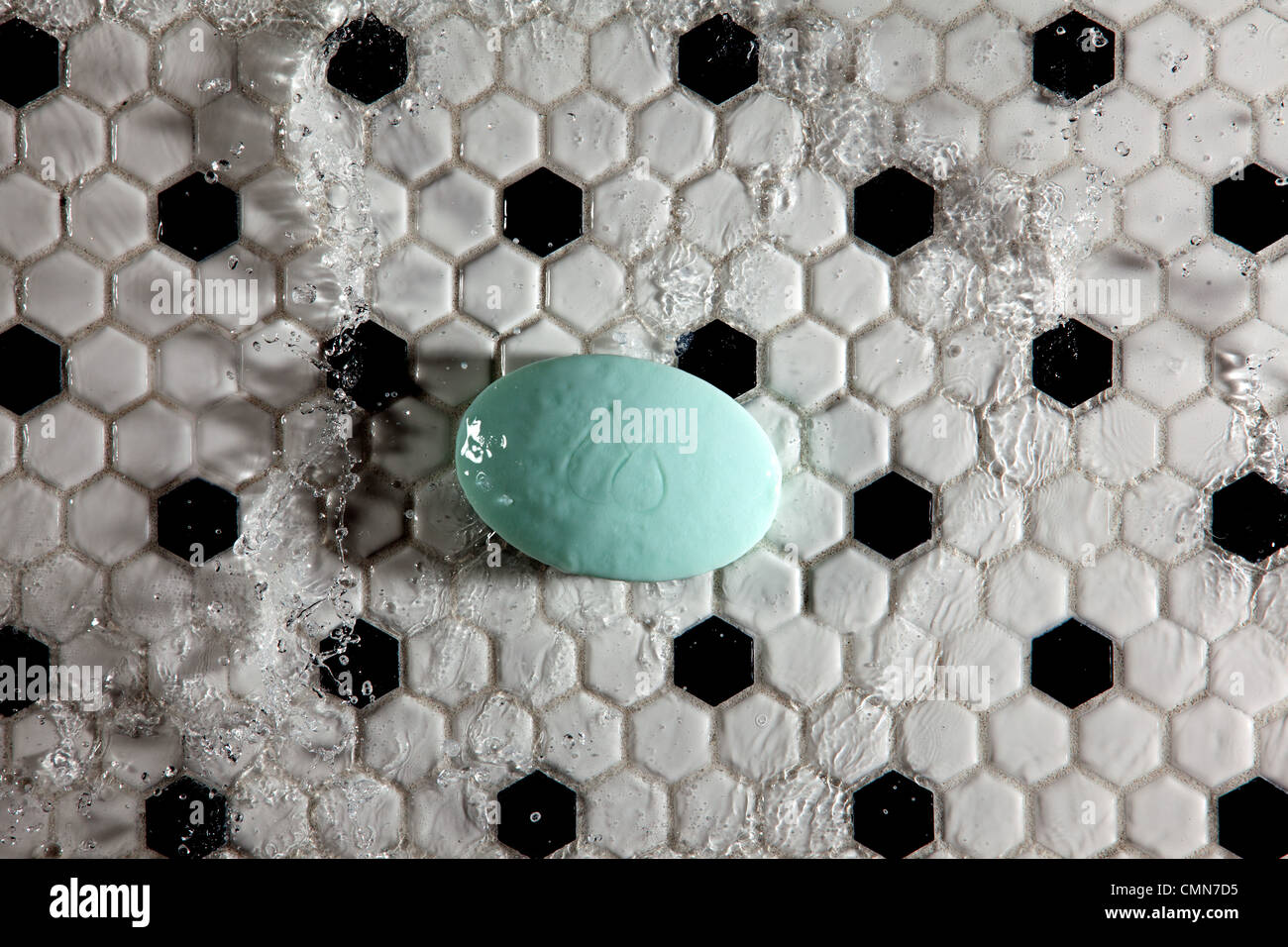 Blue Soap on the floor of a bathroom with water splash Stock Photo - Alamy