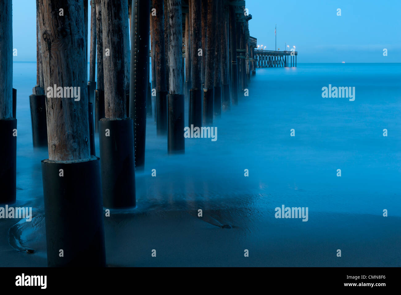Ocean and dock pilings at beach Stock Photo - Alamy