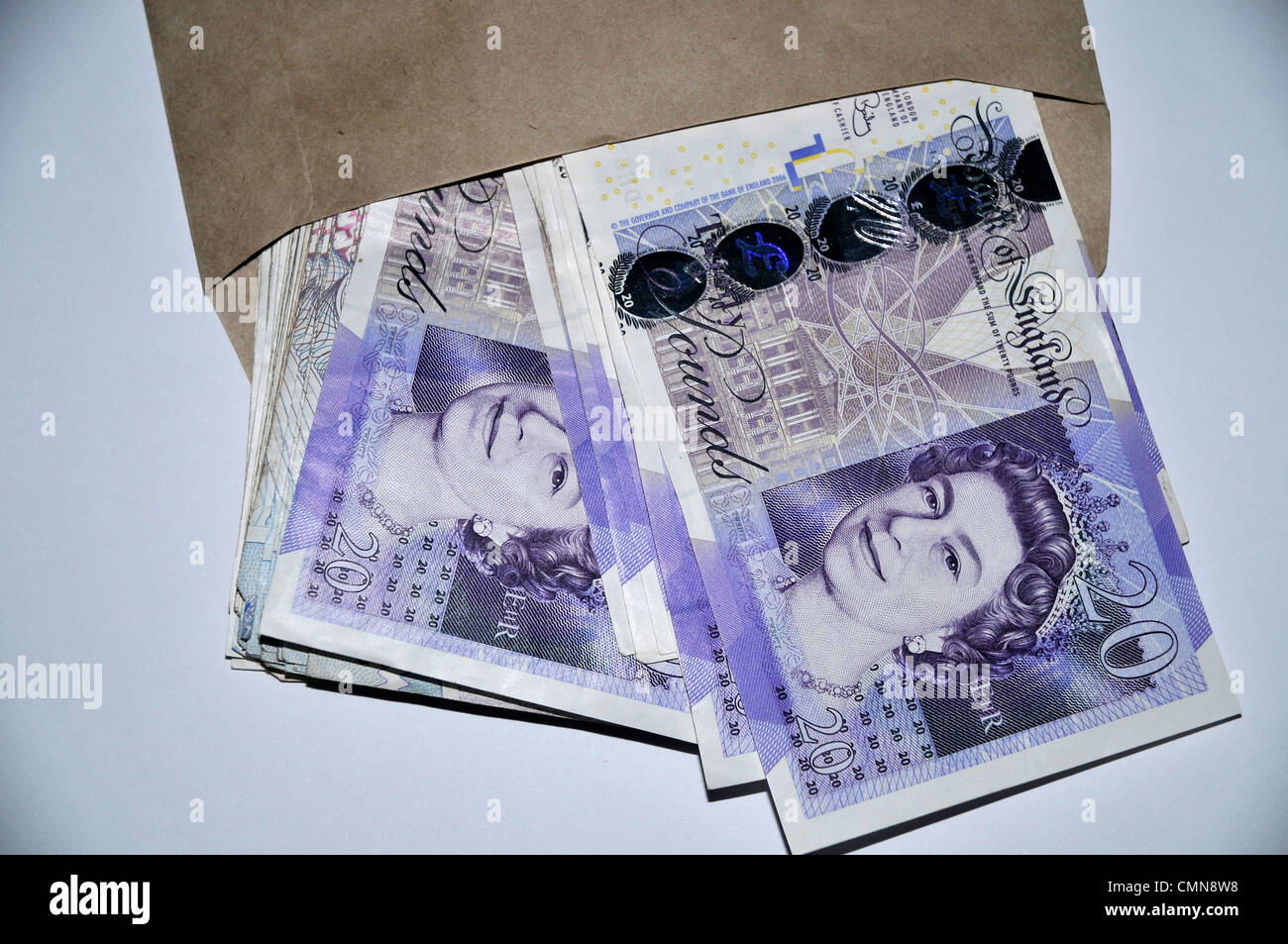 Cash in brown envelope hi-res stock photography and images - Alamy