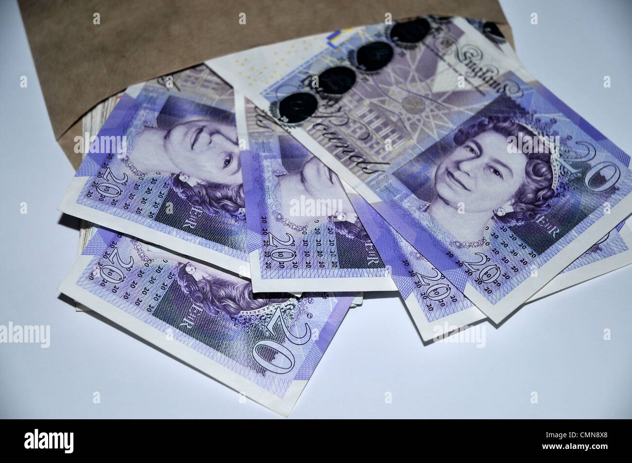 Cash in brown envelope hi-res stock photography and images - Alamy