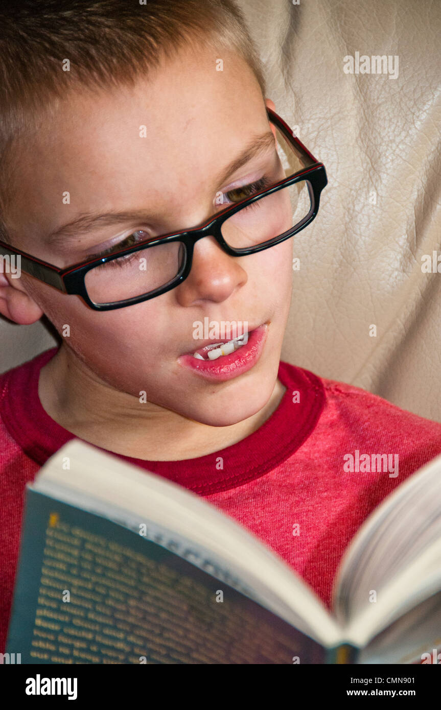 young boy reading book Stock Photo - Alamy