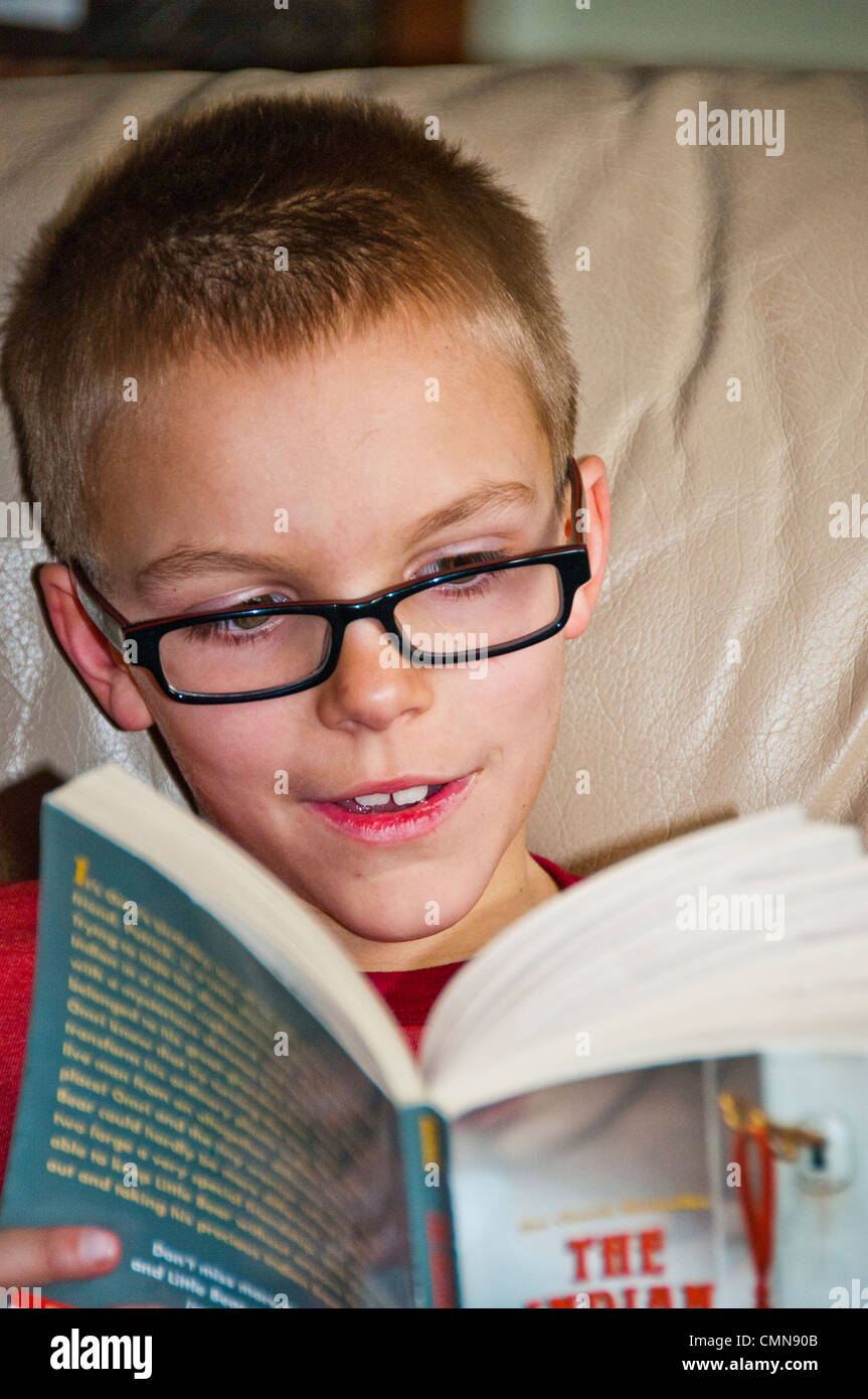 young boy reading book Stock Photo - Alamy