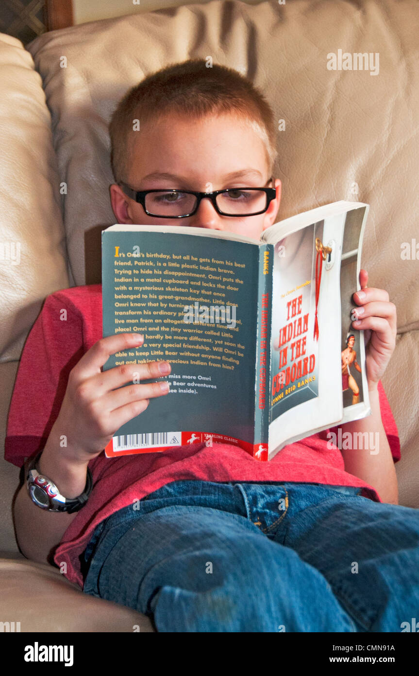 young boy reading book Stock Photo - Alamy
