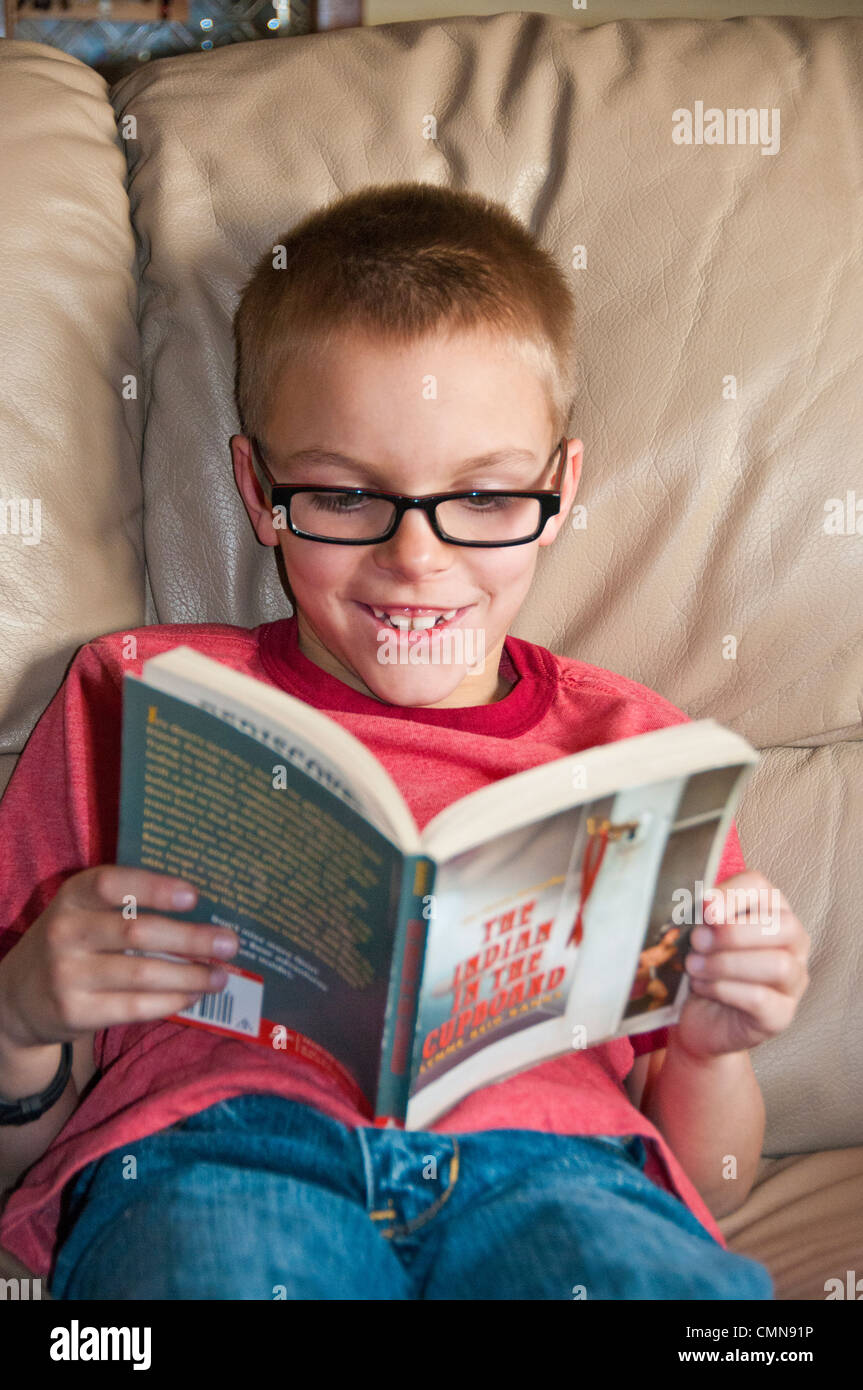young boy reading book Stock Photo - Alamy