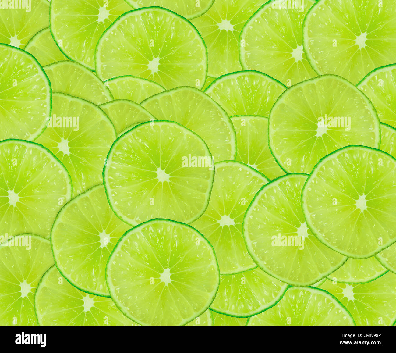 Abstract green background with citrus-fruit of lime slices. Close-up. Studio photography Stock ...
