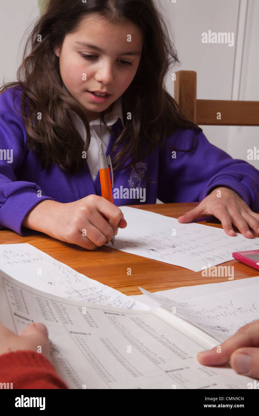 Schoolgirl having a private lesson at home Stock Photo - Alamy