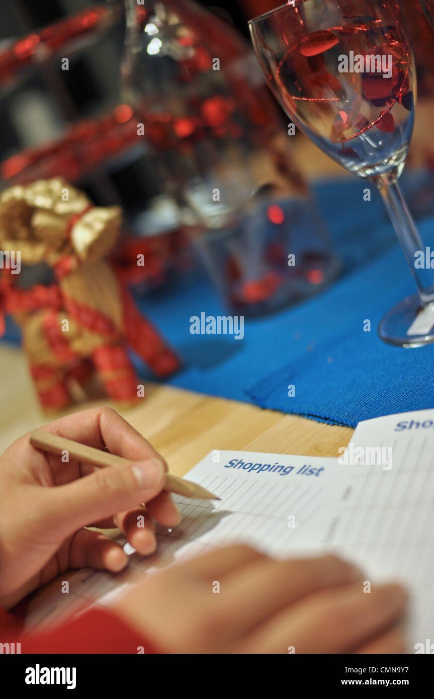 Writing shopping list for xmas season Stock Photo - Alamy