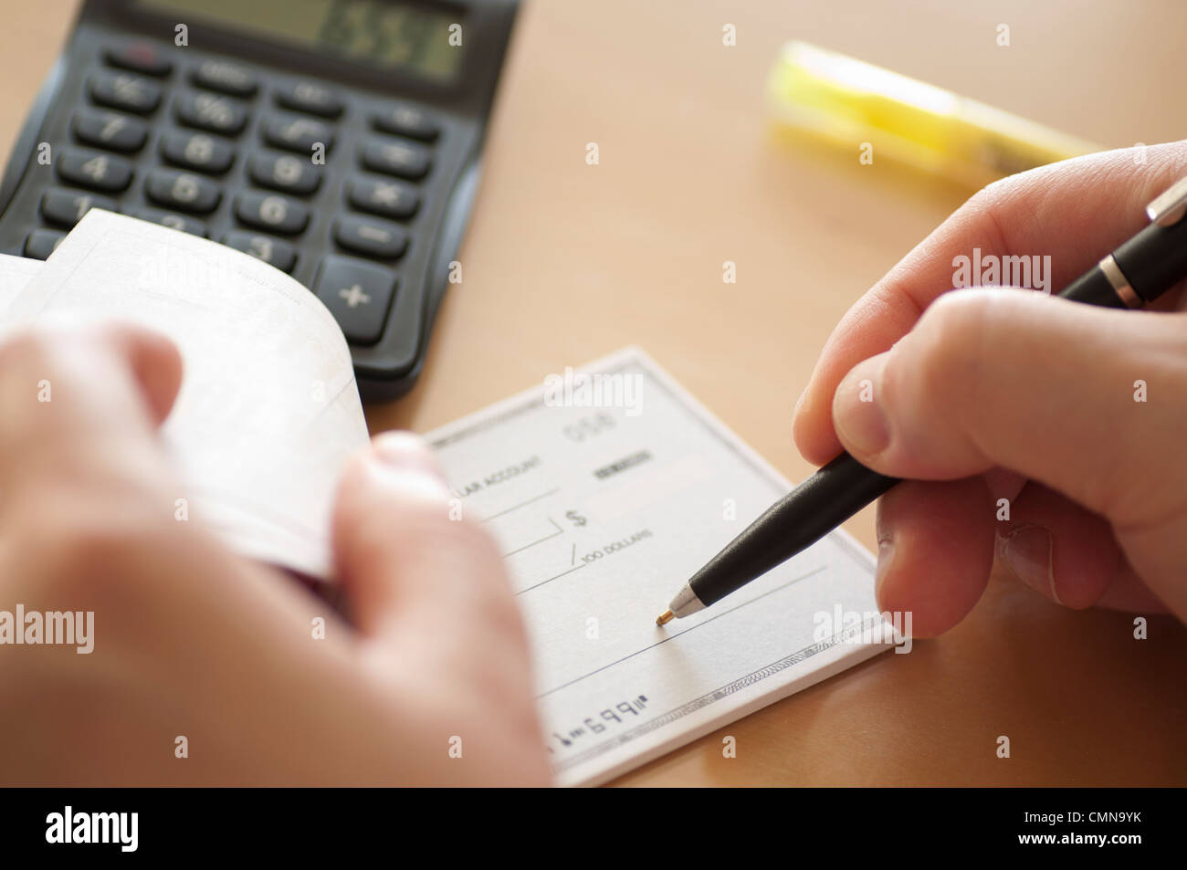 Prepare writing a check Stock Photo - Alamy