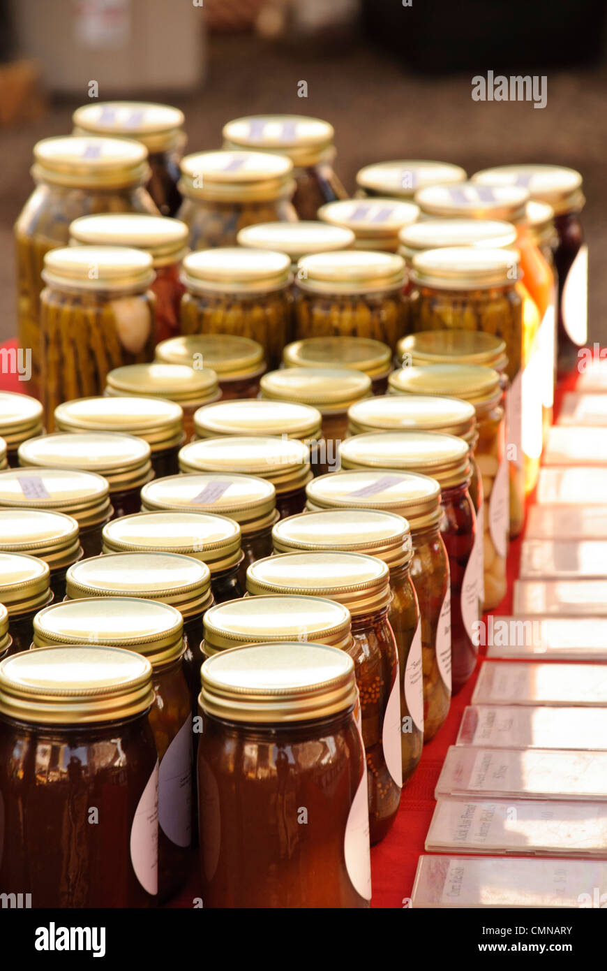 Rows of jars and bottles at farmer's market Stock Photo - Alamy