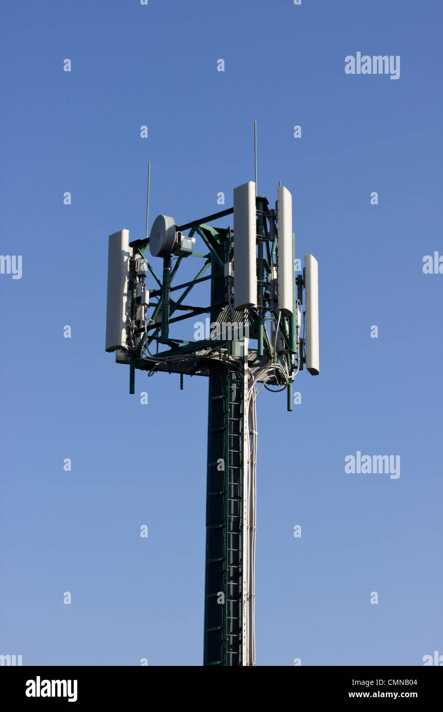 Mobile phone tower with ladder, platform and antennas Stock Photo - Alamy