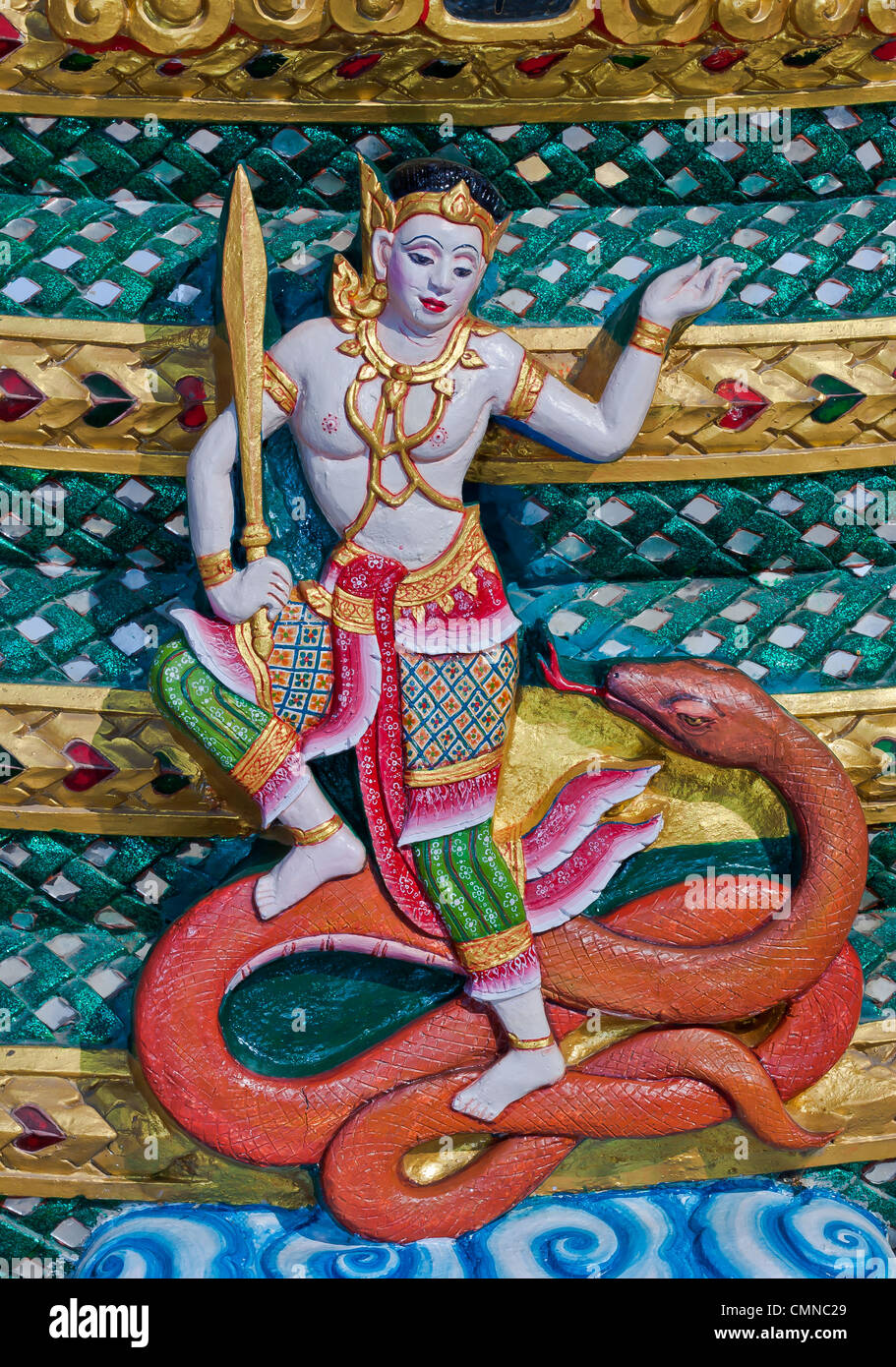 Native art carved on the wall in the temple Stock Photo - Alamy