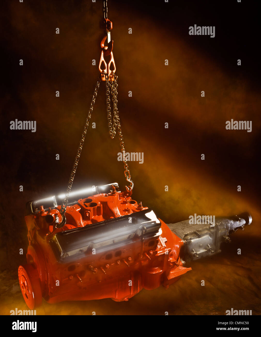 Large engine block being moved in garage Stock Photo - Alamy