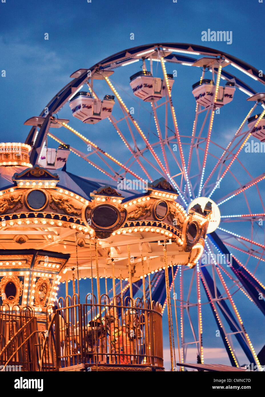 Carousel and Ferris Wheel at Carnival Stock Photo - Alamy