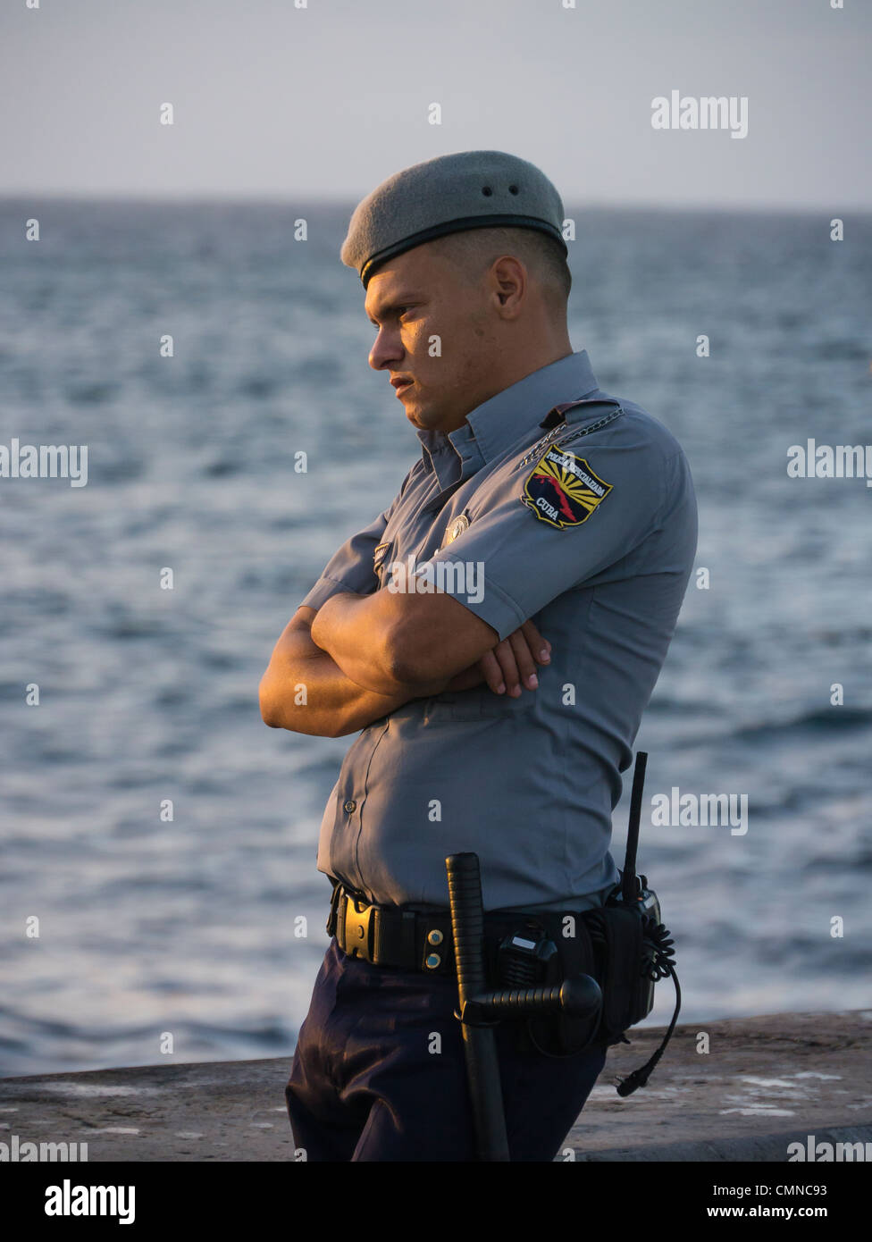 A Cuban policeman, a member of the "Policia Especializada," stands ...
