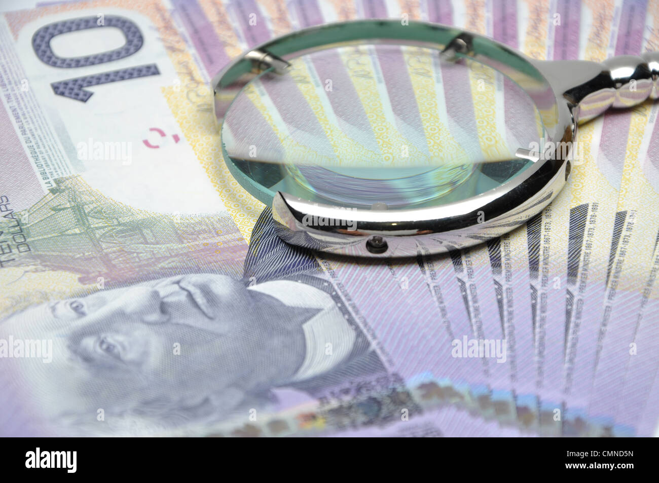 Money with magnifier background Stock Photo - Alamy