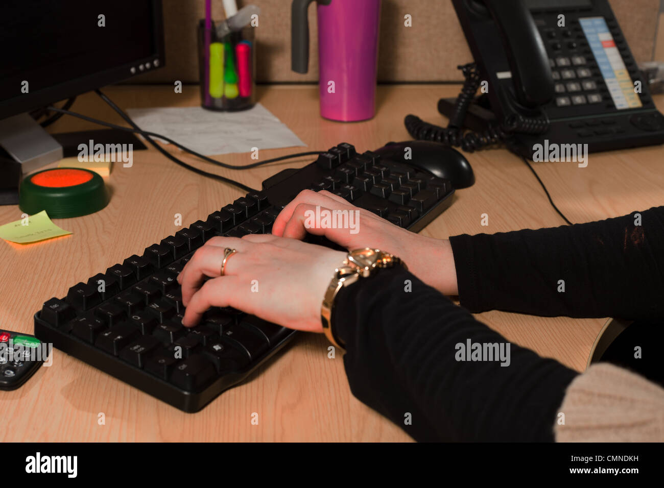 Office typing by a female worker Stock Photo - Alamy