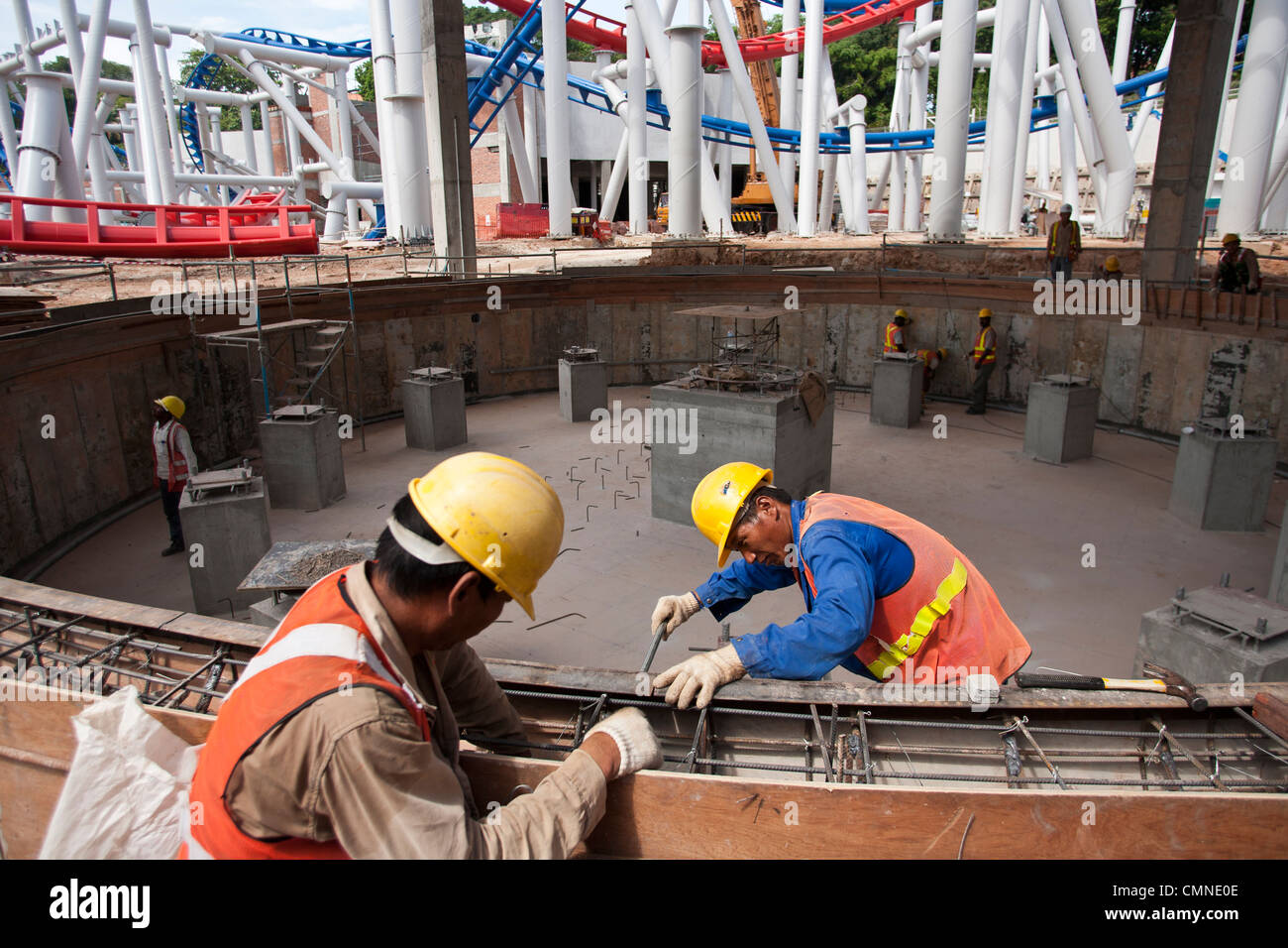 Migrant workers from China work on the construction site of Resorts ...