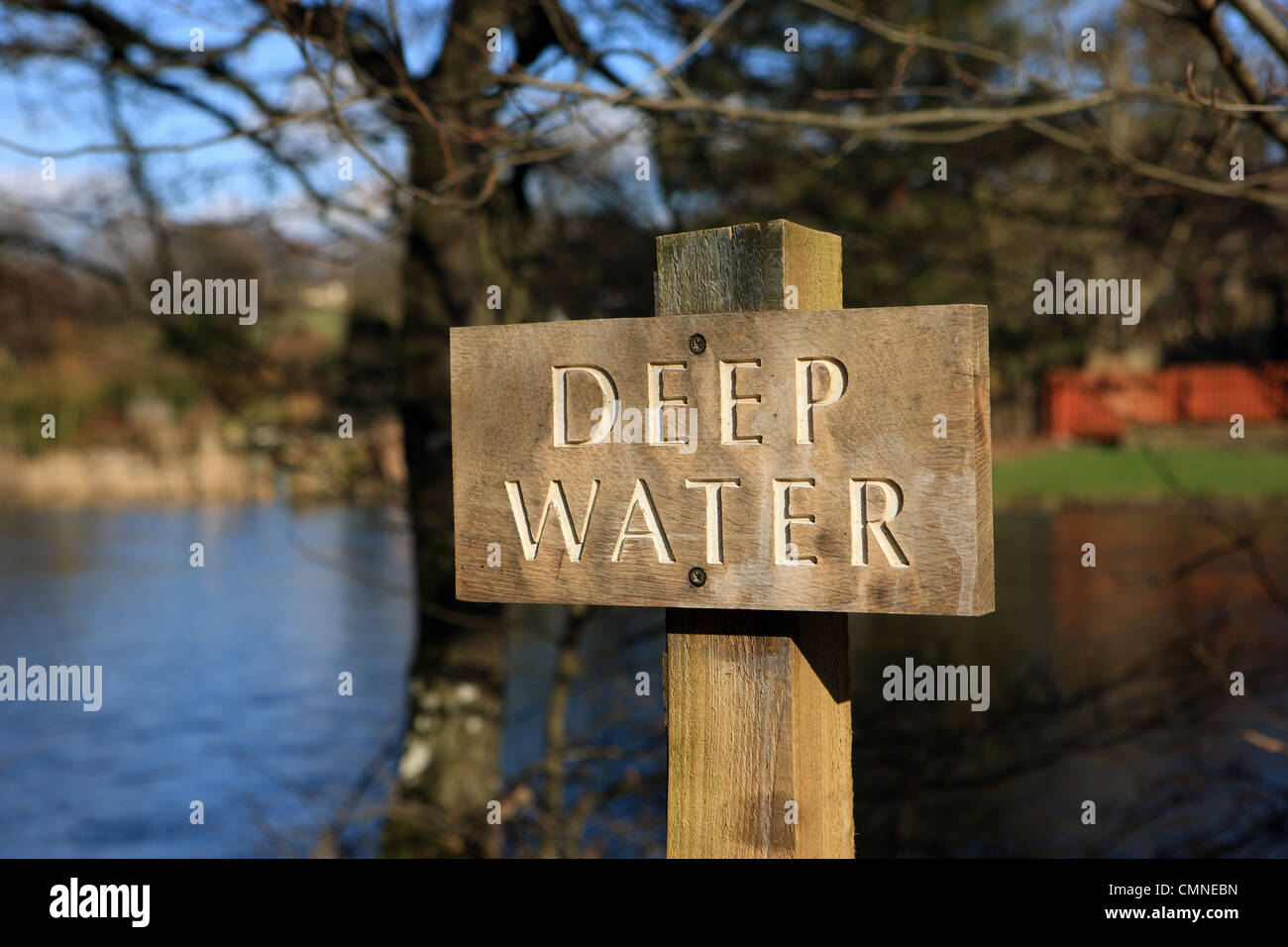 Deep Water sign at the side of a river Stock Photo - Alamy