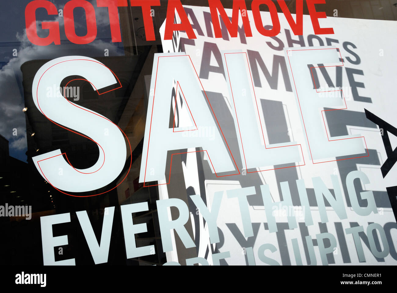 Eye catching ' SALE ' signs in a shop window Stock Photo - Alamy