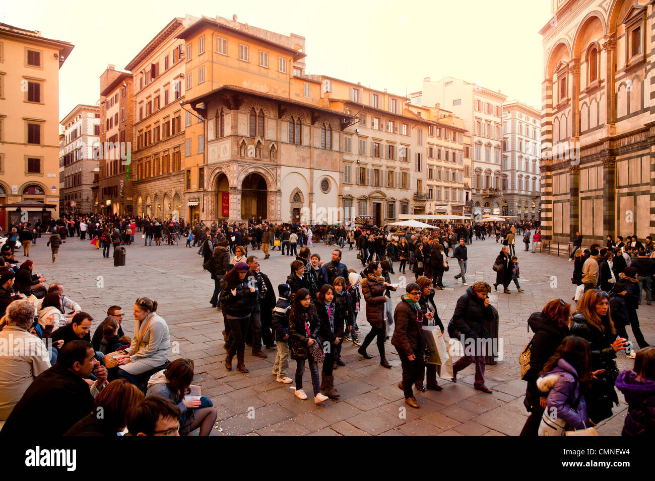 Afternoon crowds of tourists walking behind the Duomo, Florence, Italy ...