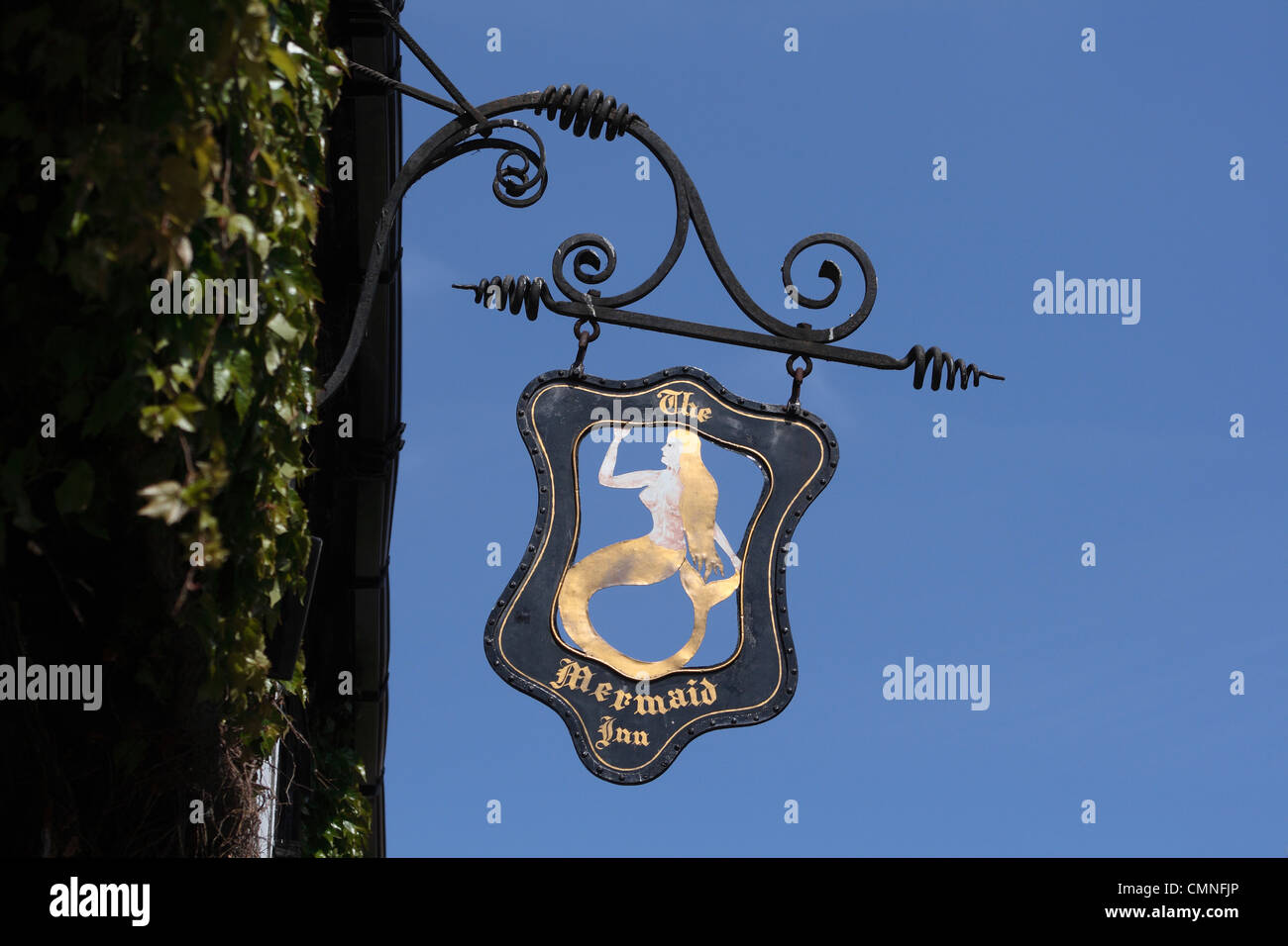 Rye The Mermaid Inn pub sign against blue sky Stock Photo - Alamy
