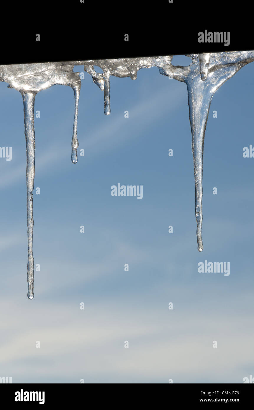 stalactites of ice with water drops under a roof Stock Photo - Alamy