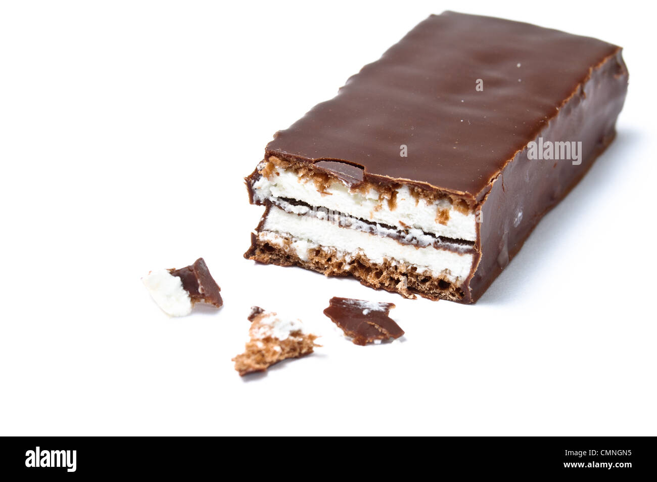 Chocolate bar with skimmings filling cut with crumbs isolated on white ...